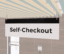 White Self-Checkout Sign With Black Text On White Background